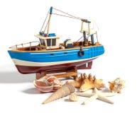 Toy Boat With Shells On A Blue Wooden Background For Summer, Hol ...