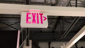 Motion Of Emergency Exit Sign On Ceiling Inside Shopping Mall Stock ...