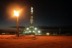 Oil Drilling Rig at Night stock photo. Image of lighted - 11700010