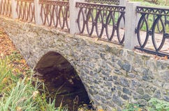 Stone Bridge Over Stream Landscape Stock Image - Image of flowing ...