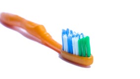 Orange Toothbrush And Toothpaste On White Stock Photo - Image: 12079570