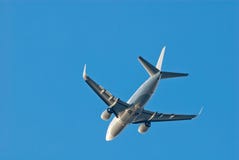 Plane On Clear Blue Sky Stock Photo - Image: 46310405