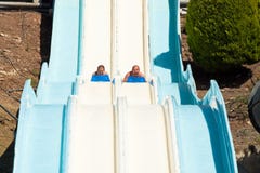 Young People Having Fun On Water Slides In Aqua Park Stock Photography ...