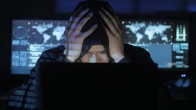 A Tired Hacker Working At A Computer In A Dark Room. He Laid His Head ...