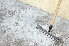 Man Raking Concrete Stock Photo - Image: 6847200