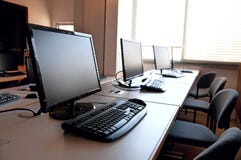 Row Of Computers On Desk Stock Image - Image: 23837711