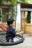 Sad Lonely Boy Sitting On Swing Stock Image - Image: 37529275