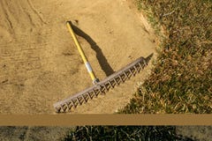 Sand Pit with Rake stock image. Image of rake, bunker - 4082551