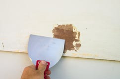 Man Scraping Paint Off Wall Stock Photo - Image: 31827942