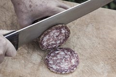 Salami slicing stock image. Image of knife, delicious - 13422435