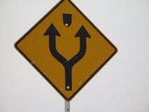 Yellow Sign With Split Arrows Stock Image - Image of arrow, directional ...