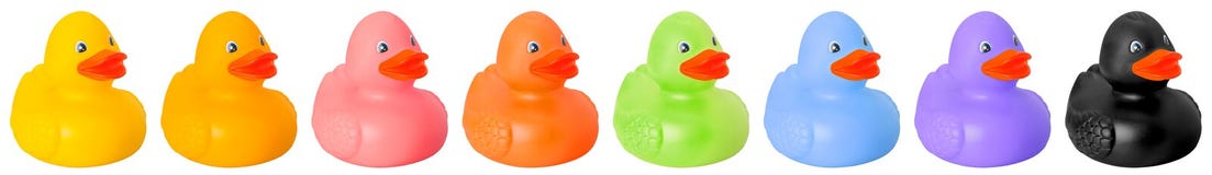 Pink, Purple Rubber Duck With Yellow Ducks Stock Photo - Image: 1980878