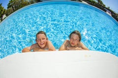 Two Boys At The Pool stock image. Image of faces, beach - 5613089