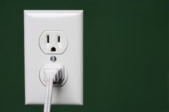 Power Cord Plugged Into Wall Outlet. Stock Photo - Image: 25698924