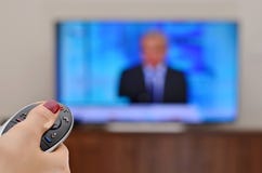Watching TV And Using Black Modern Remote Controller. Hand Holding TV ...