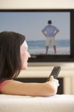 Woman watching tv at home stock image. Image of smile - 2714431