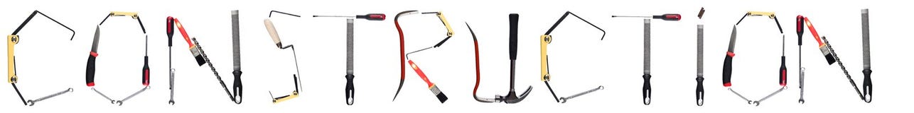 Construction Word Blocks Stack On Blueprints And Floor Plan Stock Photo ...