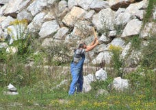 Man breaking rocks stock photo. Image of rock, quarry - 2581092