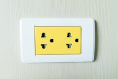 Wall Outlet - Yellow Plug Stock Image - Image: 2029091