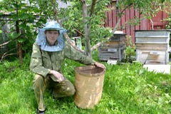 Young Beekeeper Boy Using A Smoker On Bee Yard Stock Photo - Image ...