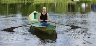 Teenager Rowing A Boat Royalty Free Stock Image - Image: 29035556