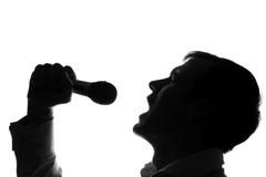 Side View Of A Young Man Singing Into Microphone Stock Photo - Image ...