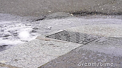 4K Footage of Water Pouring from Manhole in Roadside Drain. Stock ...