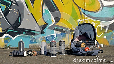 Used Spray Paint Cans in a Backpack Near a Graffiti Wall. Stock Footage ...