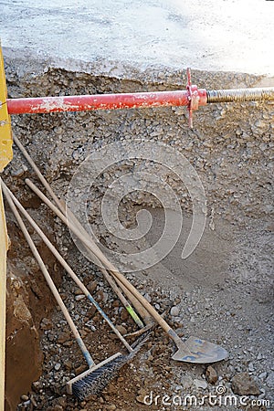 Tools Left In Building Or Construction Pit, A Broom A Shovel And A ...