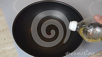 Adding oil into a wok stock footage. Video of bottle - 129295530