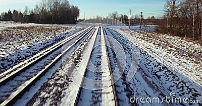 AERIAL. Camera Flight from Train Tracks To the High Winter Sunset Sky ...