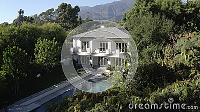 Aerial View of a Big House Surrounded by Trees with a Pool in the ...