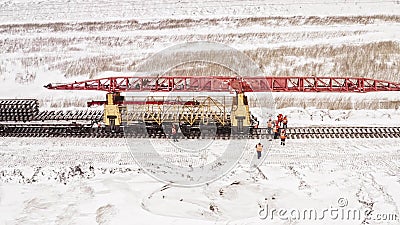 Aerial View UHD Railway Construction Machine Works In Winter. Railway ...