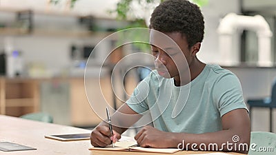 Young African Man Writing on Paper Stock Video - Video of expertise ...