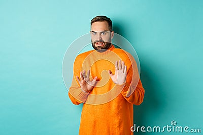 Alarmed Guy Shaking Hands In Rejection, Declining And Stepping Away ...