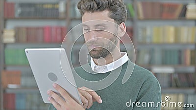 Ambitious Young Guy Scrolling on His Tablet Stock Video - Video of ...