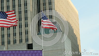American Flags Waving in the Wind in Slow Motion Against Buildings ...