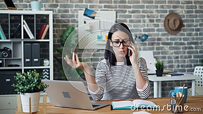 Angry Young Lady Speaking on Mobile Phone in Office Discussing Problems ...