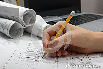 Architect Working On Blueprint. Architects Workplace - Architectural ...