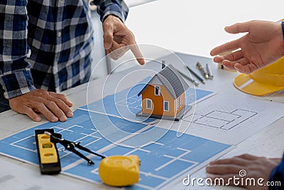 Architects Design Team Is Looking At Models Of Small Houses, Architect ...