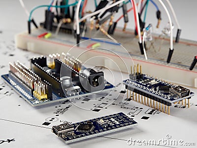 Arduino And Programmers With Peripherals And Expansion Boards Lie On A ...
