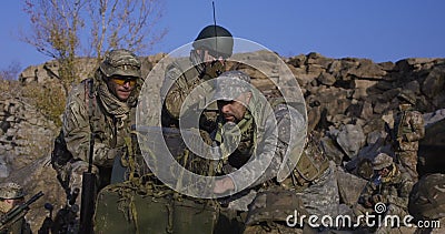 Armed Soldiers Looking at a Computer Stock Footage - Video of rocks ...