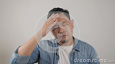 Asian Man Looking at Camera with Sad and Regret Expression ...