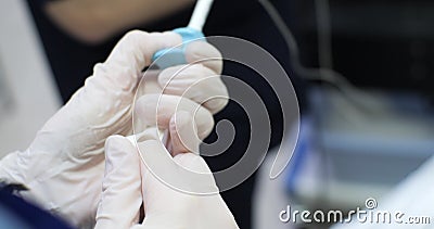 An Assistant Holds a Biopsy Equipment with His Hand during an ...