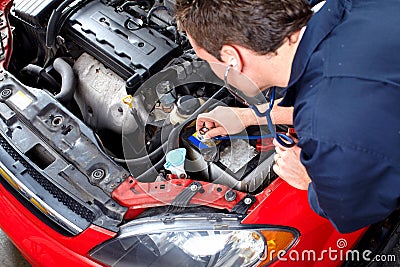 Auto Mechanic With A Stethoscope . Stock Photography - Image: 32541812