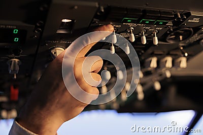 Aviation Pilot Using Control Panel In Cockpit To Fly Airborne Aircraft ...