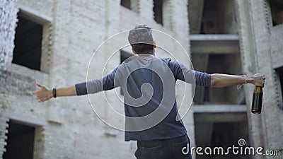 Back View of Aggressive Young Man Drinking Beer and Shouting at ...