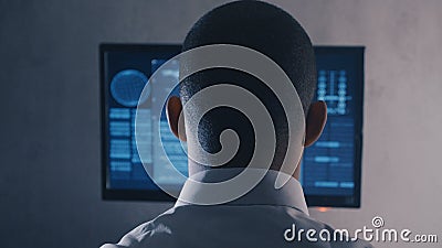 Back View of Man Programmer in White Shirt Working at Computer in the ...
