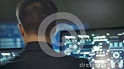 Back View of Programmer Working on Computer in Dark Digital Office ...