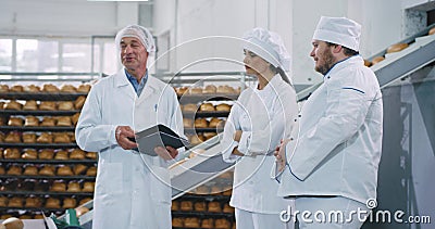 Bakery Industry Automated Conveyor Engineer Explaining Something To the ...